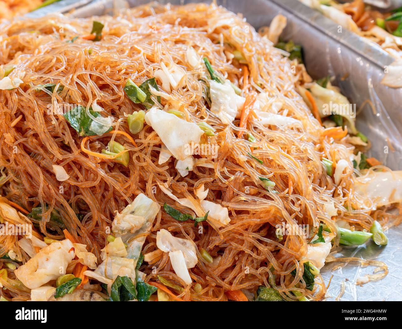 Fried glass noodles, woon sen, and cabbage, cale and carrots at market ...