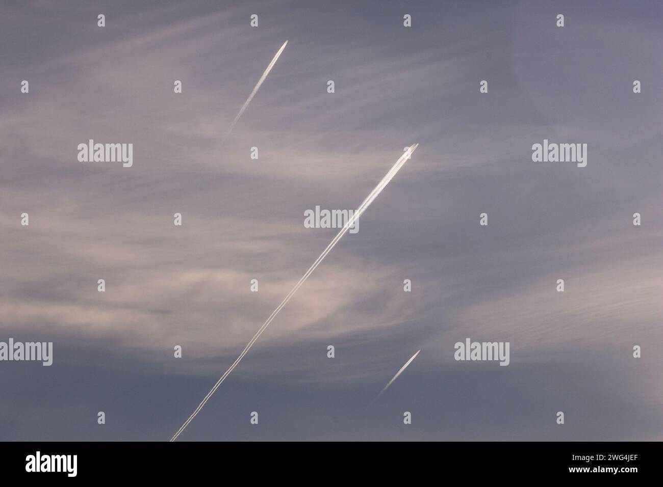 High flying passenger jets leave contrails in their wake. The extremely ... High flying passenger jets leave contrails in their wake. The extremely ...