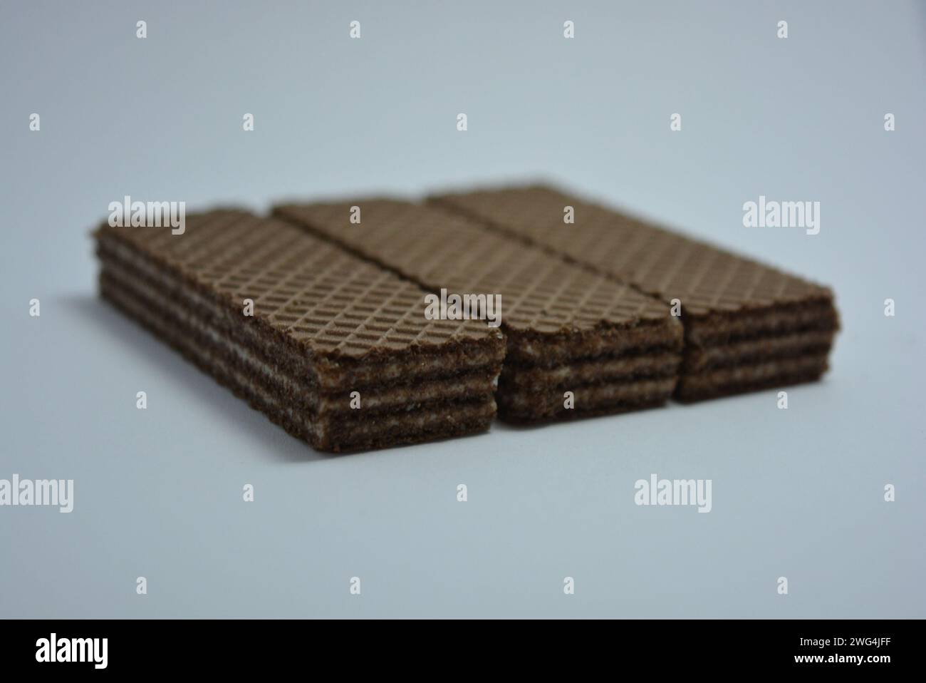 On white paper sweet chocolate wafers with white coconut filling Stock ...
