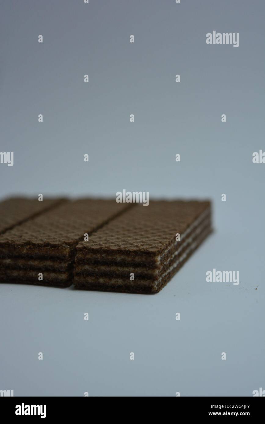 On white paper sweet chocolate wafers with white coconut filling Stock ...