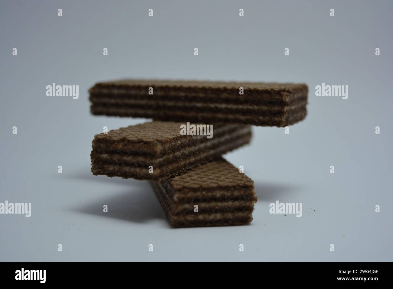 On white paper sweet chocolate wafers with white coconut filling Stock ...