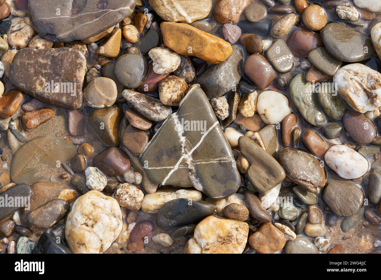 Different stones top view for background, close up Stock Photo - Alamy