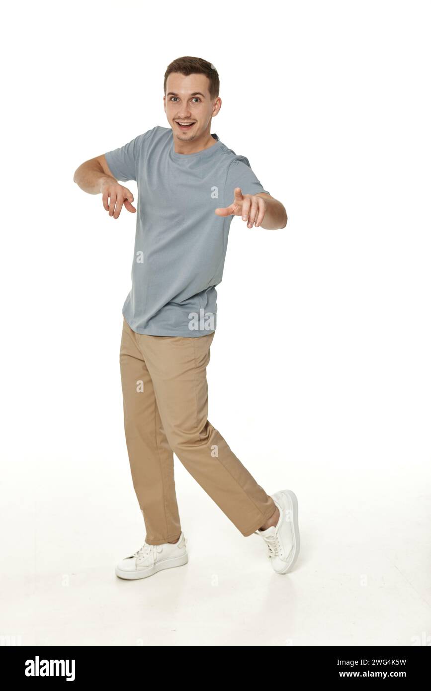 happy guy looking pointing at the camera on white studio background ...