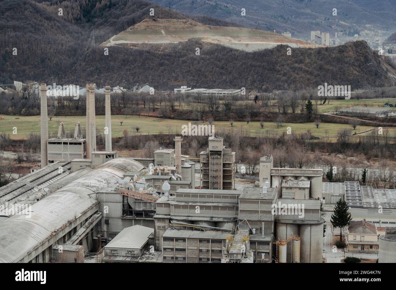 Industrial warehouse and factory with chimneys at the foot of the ...