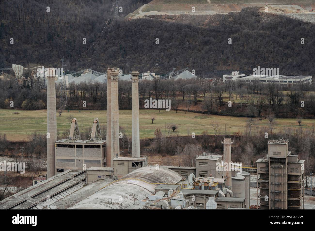 Industrial warehouse and factory with chimneys at the foot of the ...