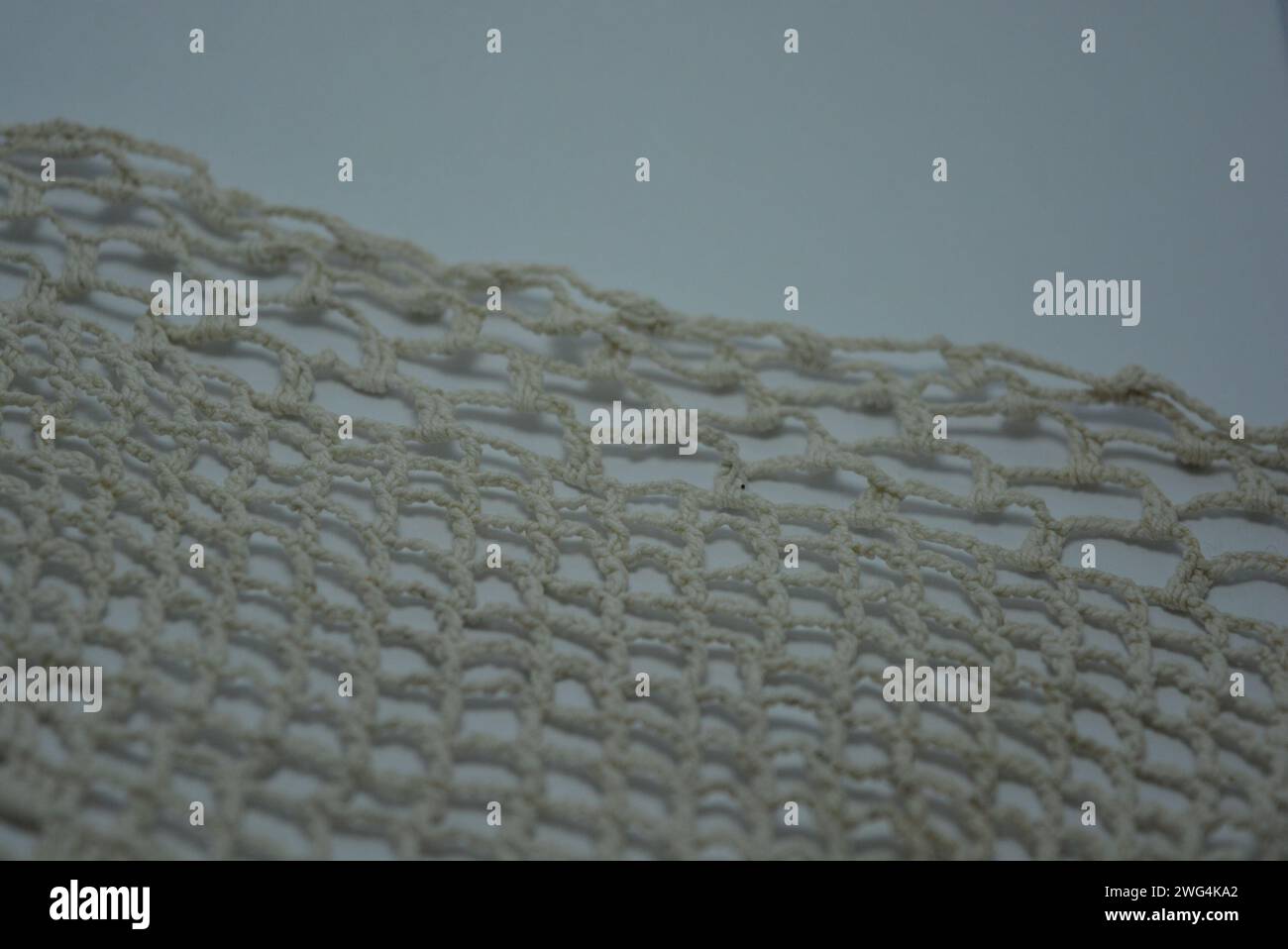 Beautiful white thread netting, macrame thread Stock Photo - Alamy