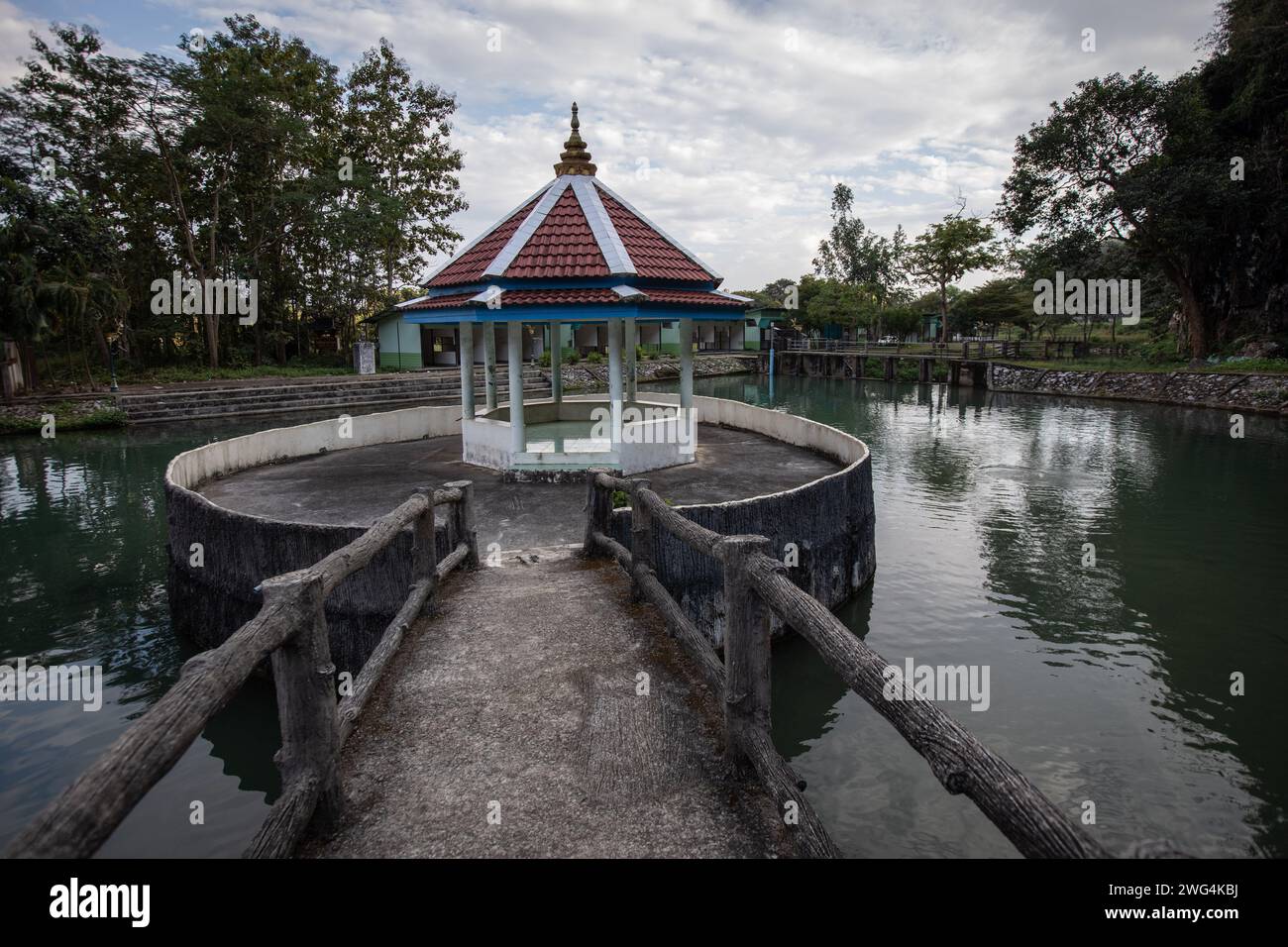 View of the small pond at the Wat Tham Pla Temple. Wat Tham Pla (Cave ...