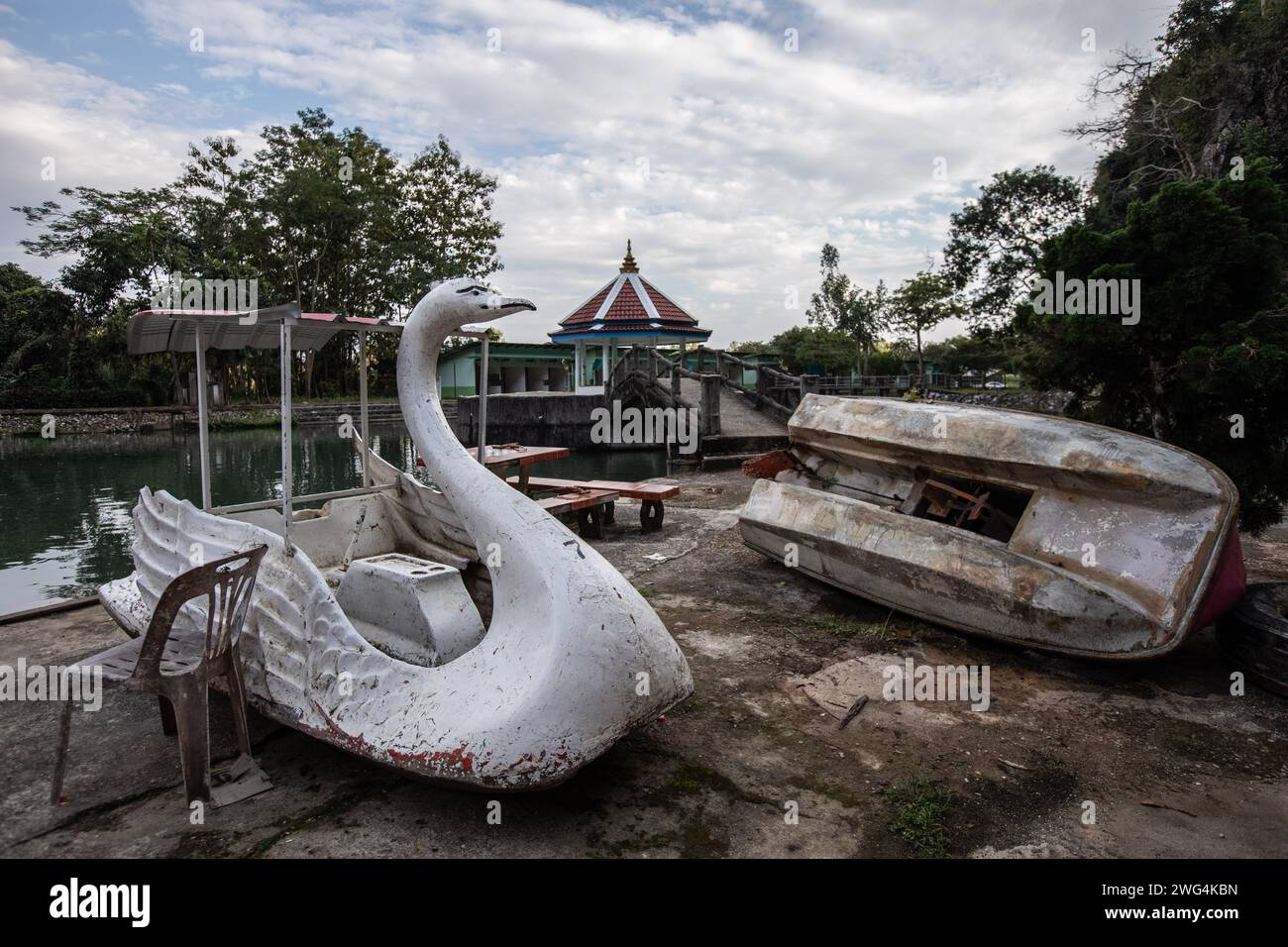 Damaged pedalo watercrafts at the Wat Tham Pla Temple. Wat Tham Pla ...