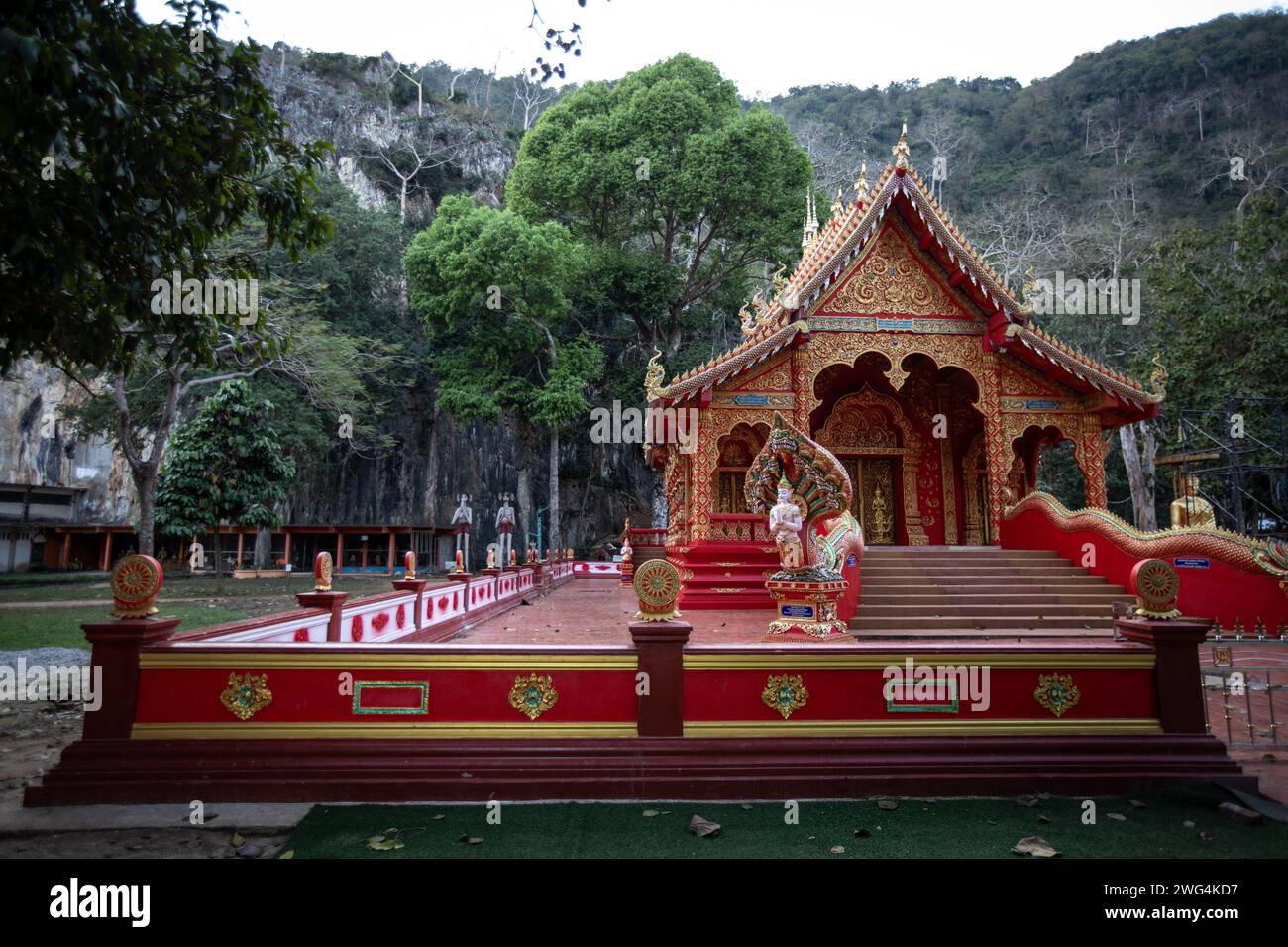 A red temple at the Wat Tham Pla Temple. Wat Tham Pla (Cave Fish Temple ...