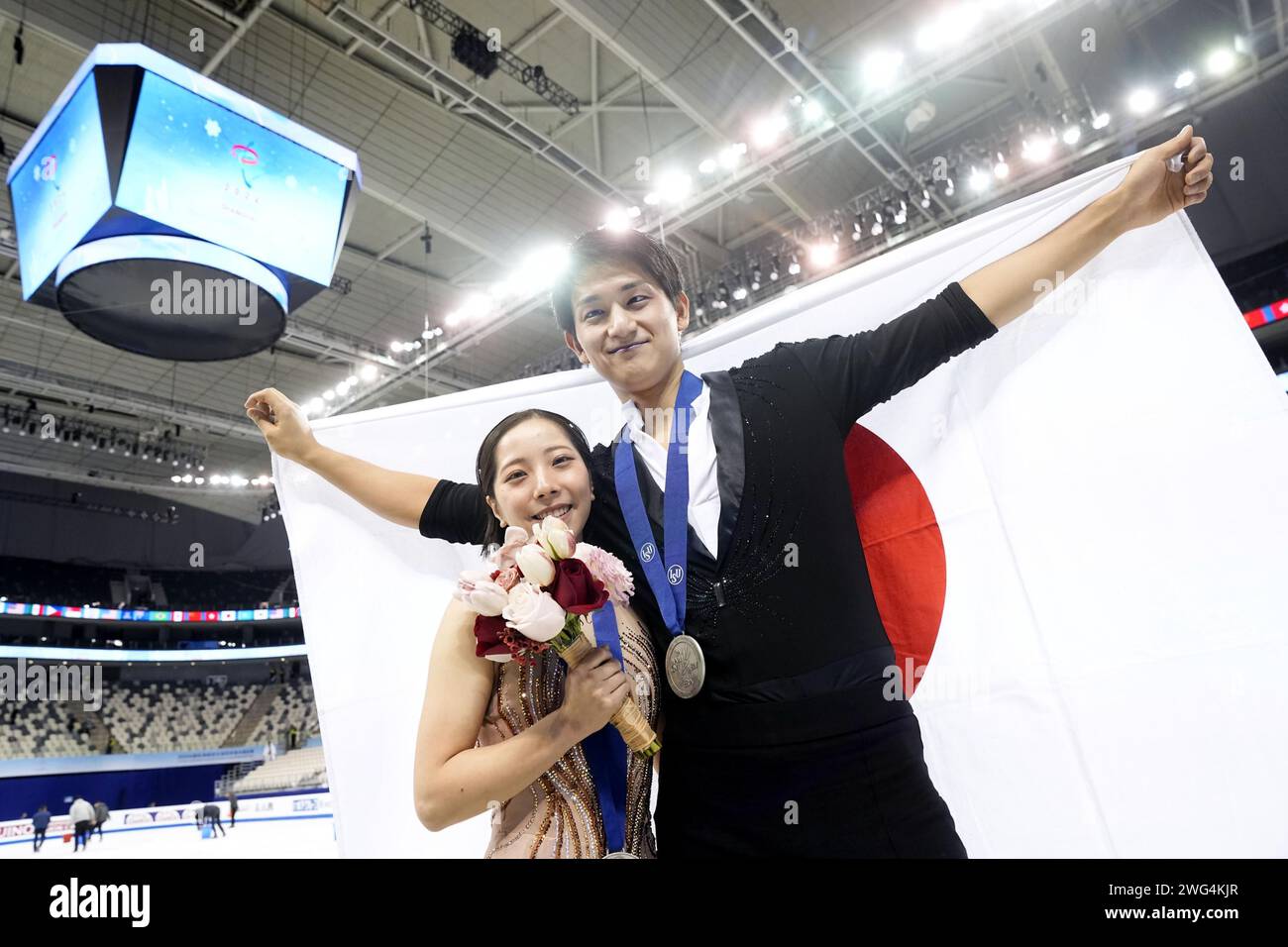 Japanese pair Riku Miura (L) and Ryuichi Kihara pose after winning the ...