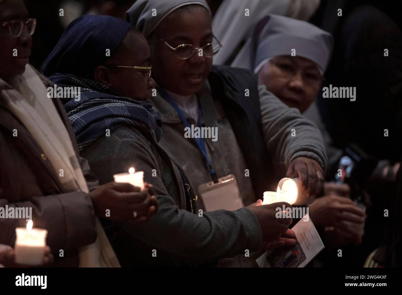 Vatican City, Vatican, 2 february, 2024. Nuns hold candles during the ...