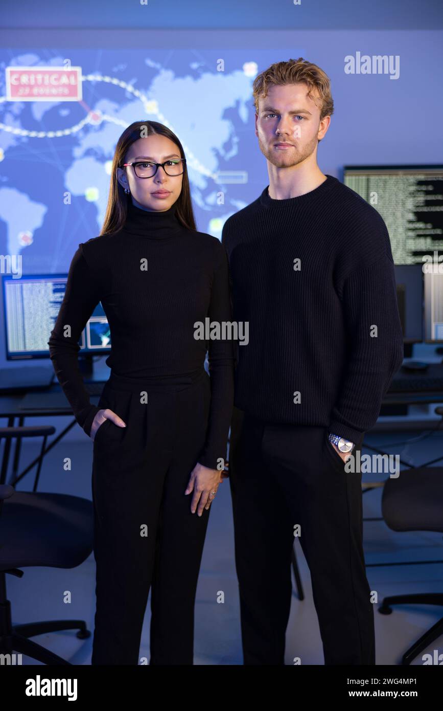 Professional and confident cyber security team standing in front of ...