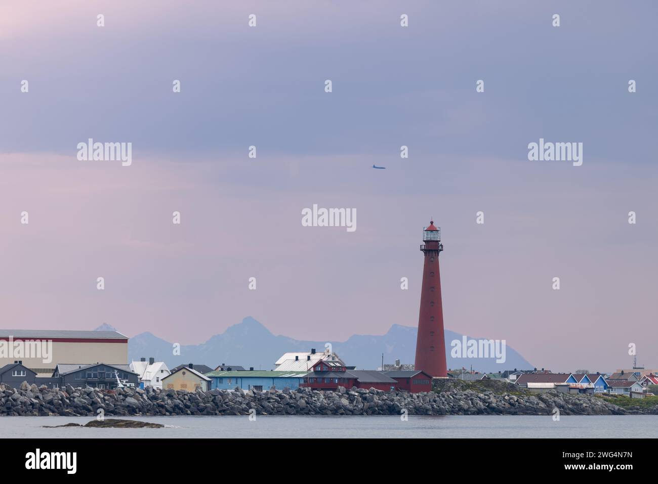 Andenes lighthouse stands as a red sentinel on Norway's rocky coastline ...