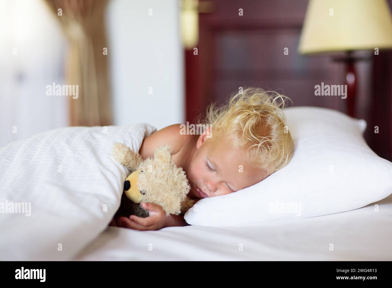 Baby sleeping in white bed. Healthy kids sleep. Little boy napping in ...