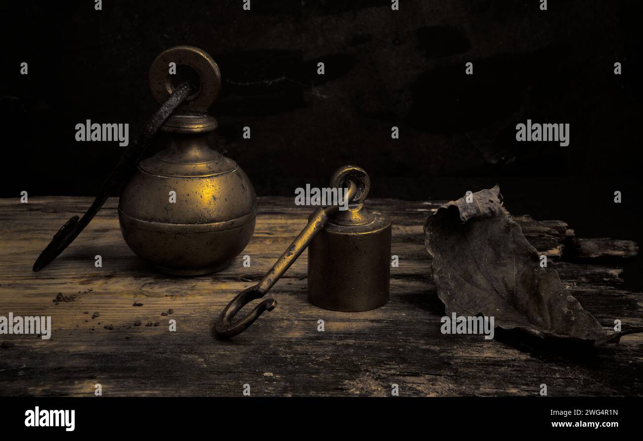 still life with antique brass scale weights Stock Photo - Alamy