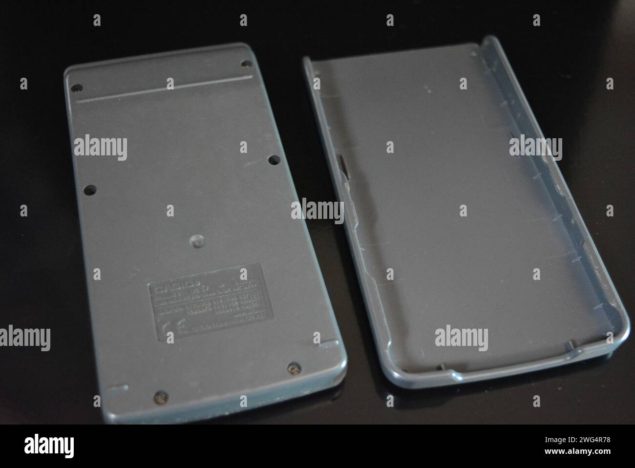 A gray calculator made of quality plastic with beautiful colors located ...