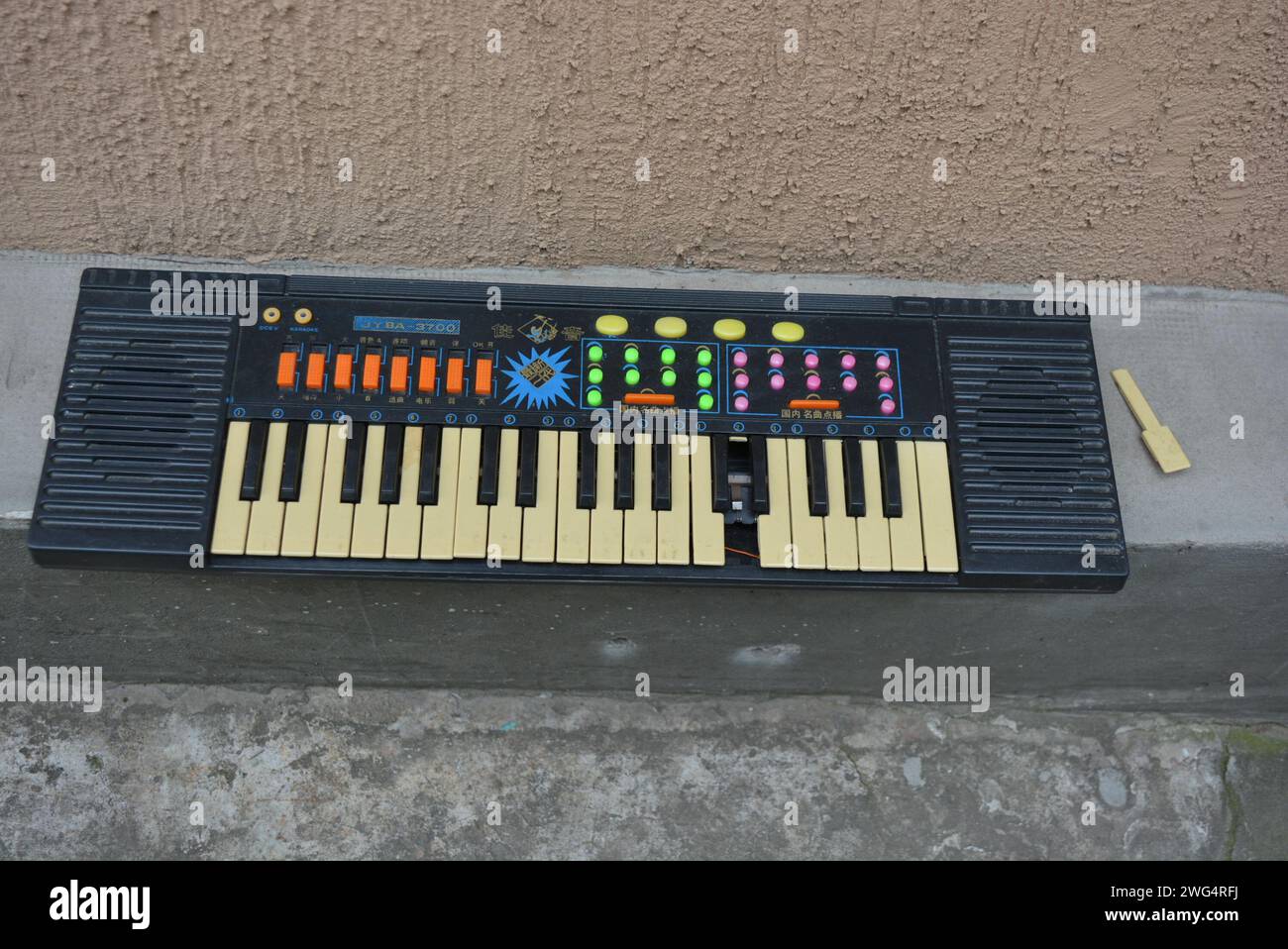 Children's plastic synthesizer with black and white keys arranged and ...