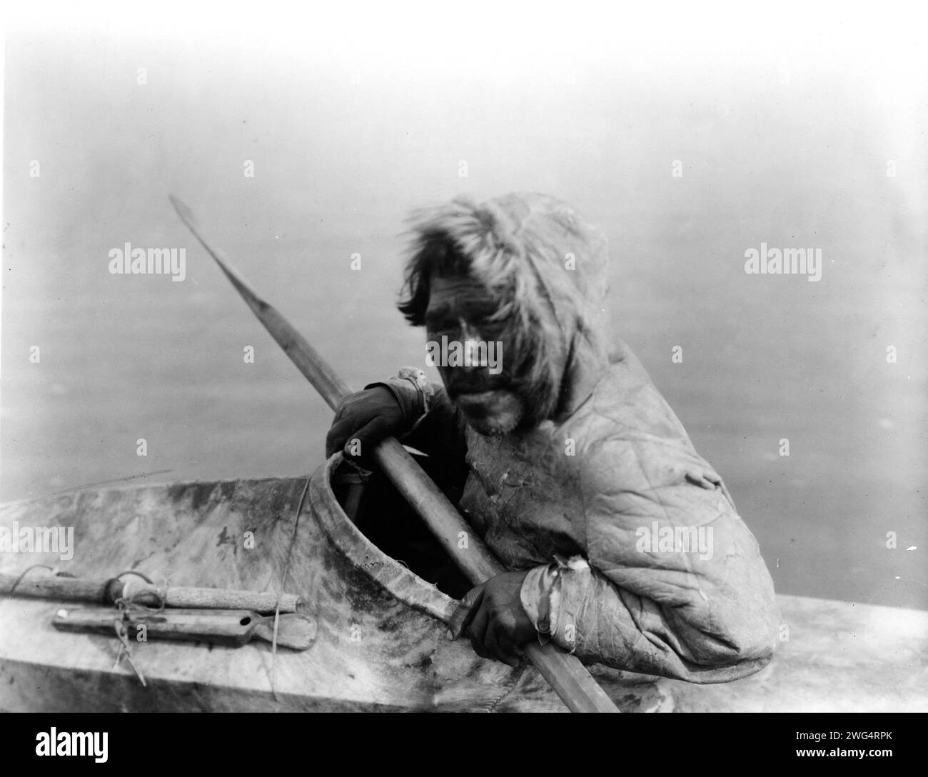 The seal-hunter, Noatak, in kayak, facing left, c1929 Stock Photo - Alamy