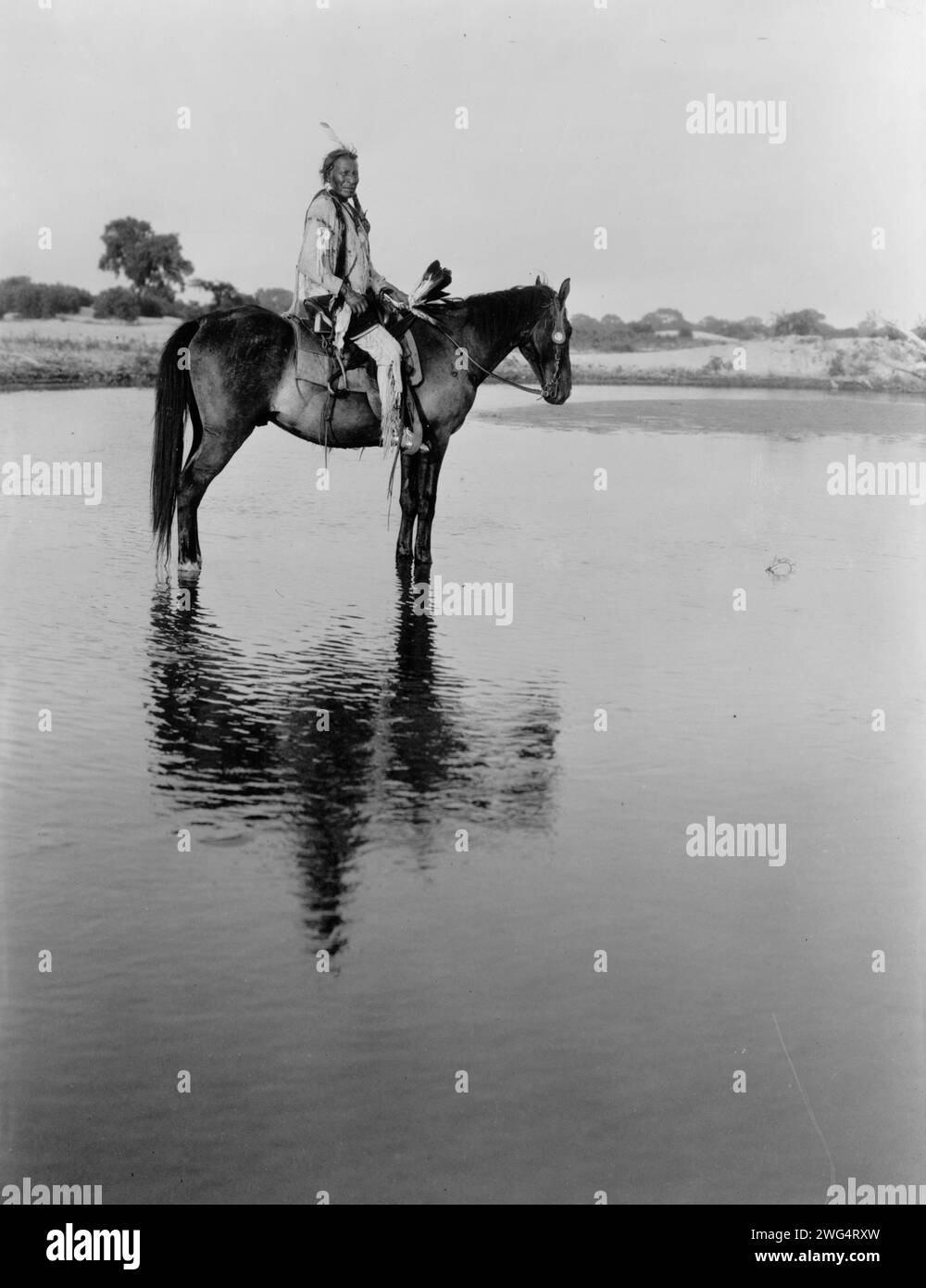 The lone Chief-Cheyenne, c1927. Cheyenne man on horseback in shallow ...