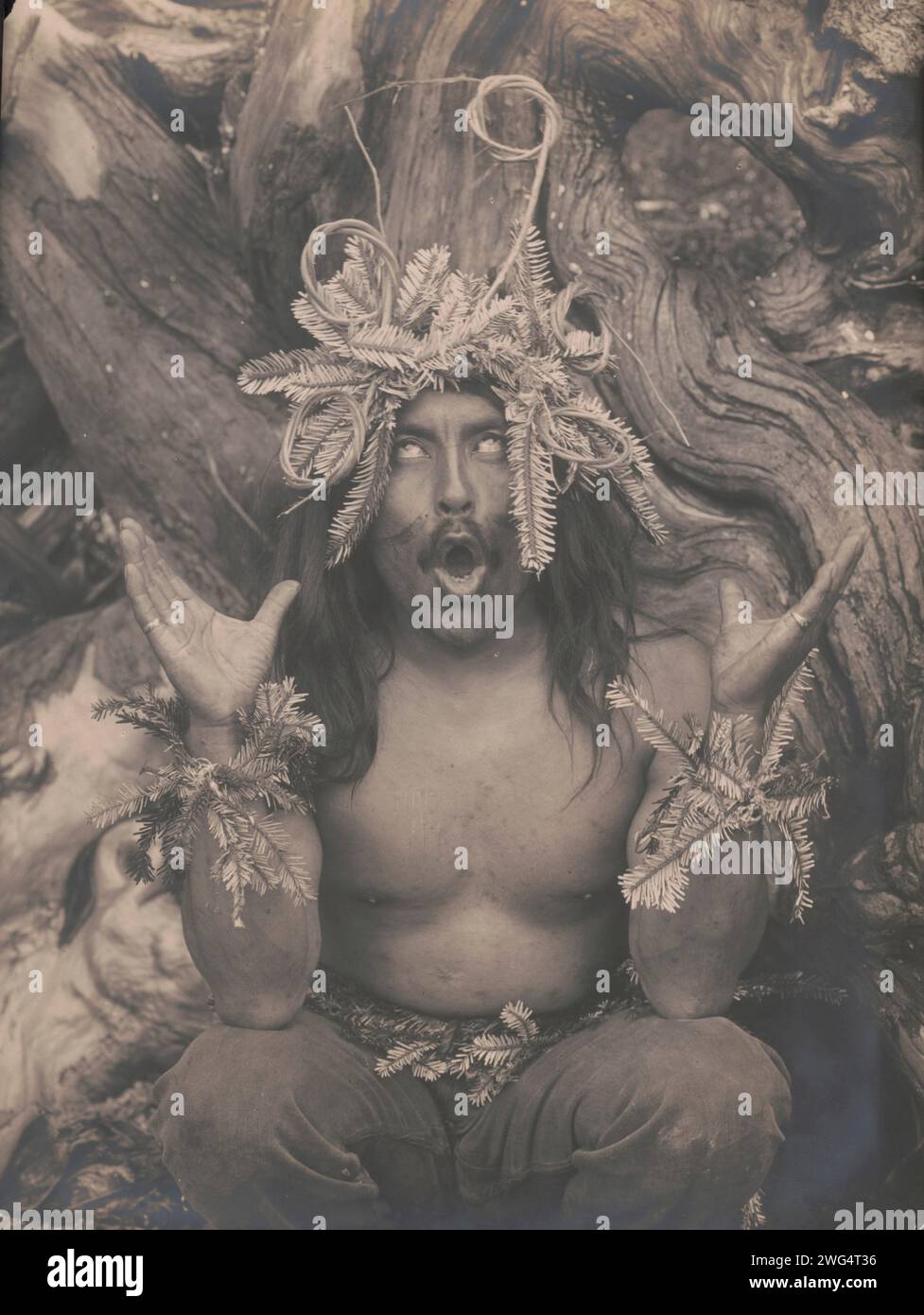 Hamatsa emerging from the woods-Koskimo, c1914. Hamatsa shaman, three ...