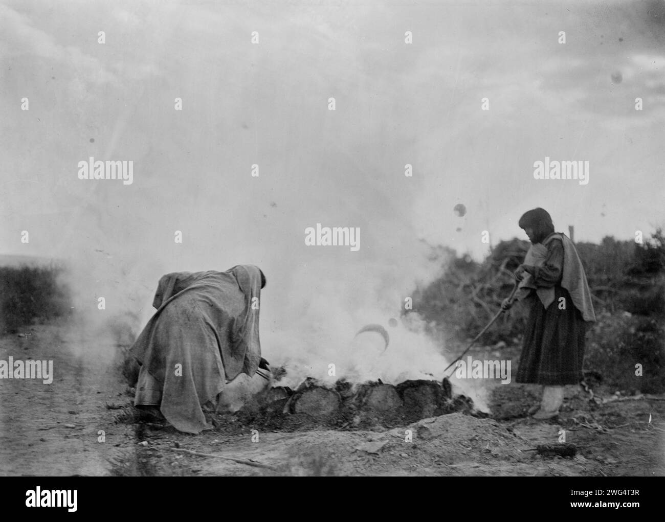 Pottery burners at Santa Clara, c1905. Photograph shows two women ...