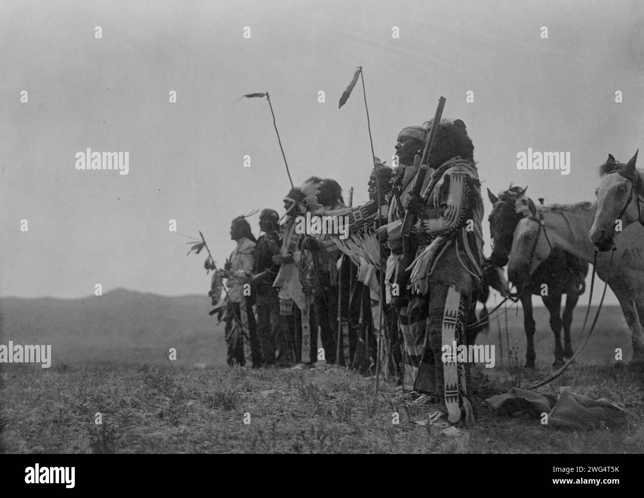 Awaiting the scouts return, Atsina, c1908. Photograph shows a group of ...