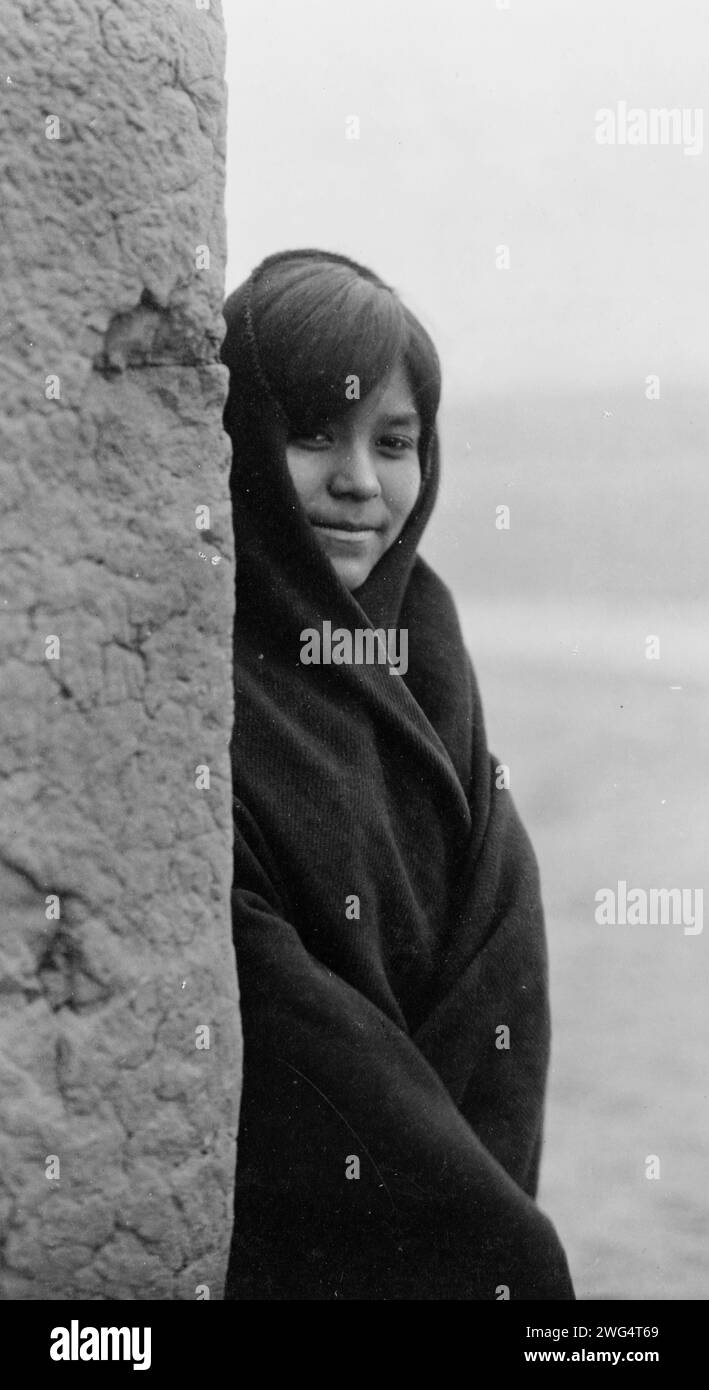 Zuni girl, c1903. Three-quarter length portrait of Zuni girl peering ...
