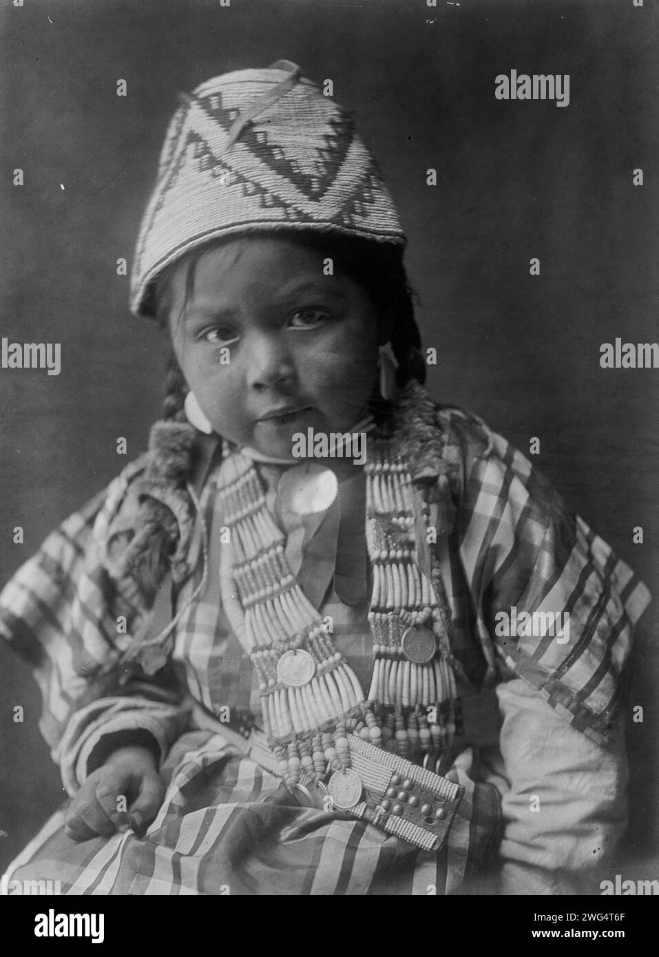 Wishham child, c1910. Portrait of a girl, three-quarter length, seated ...