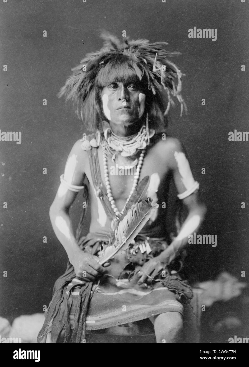 Honovi-Walpi snake priest, with Totkya Day painting, c1910. Hopi snake ...