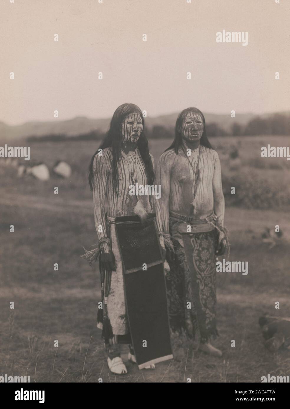 Sun dance pledgers-Cheyenne, c1910. Two young men in ceremonial paint ...