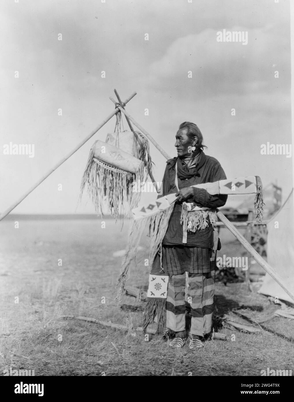 In a Blackfoot camp, c1927. Blackfoot man, full-length portrait ...