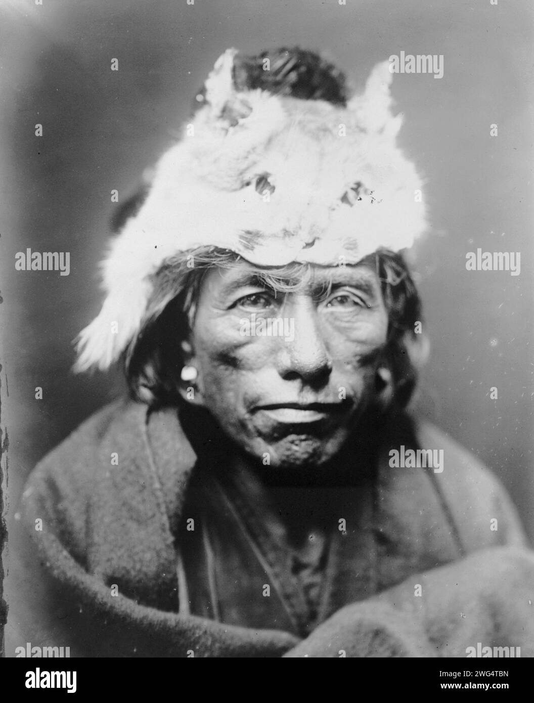 Lynx cap, c1905. Head-and-shoulders portrait of Navajo man wearing ...