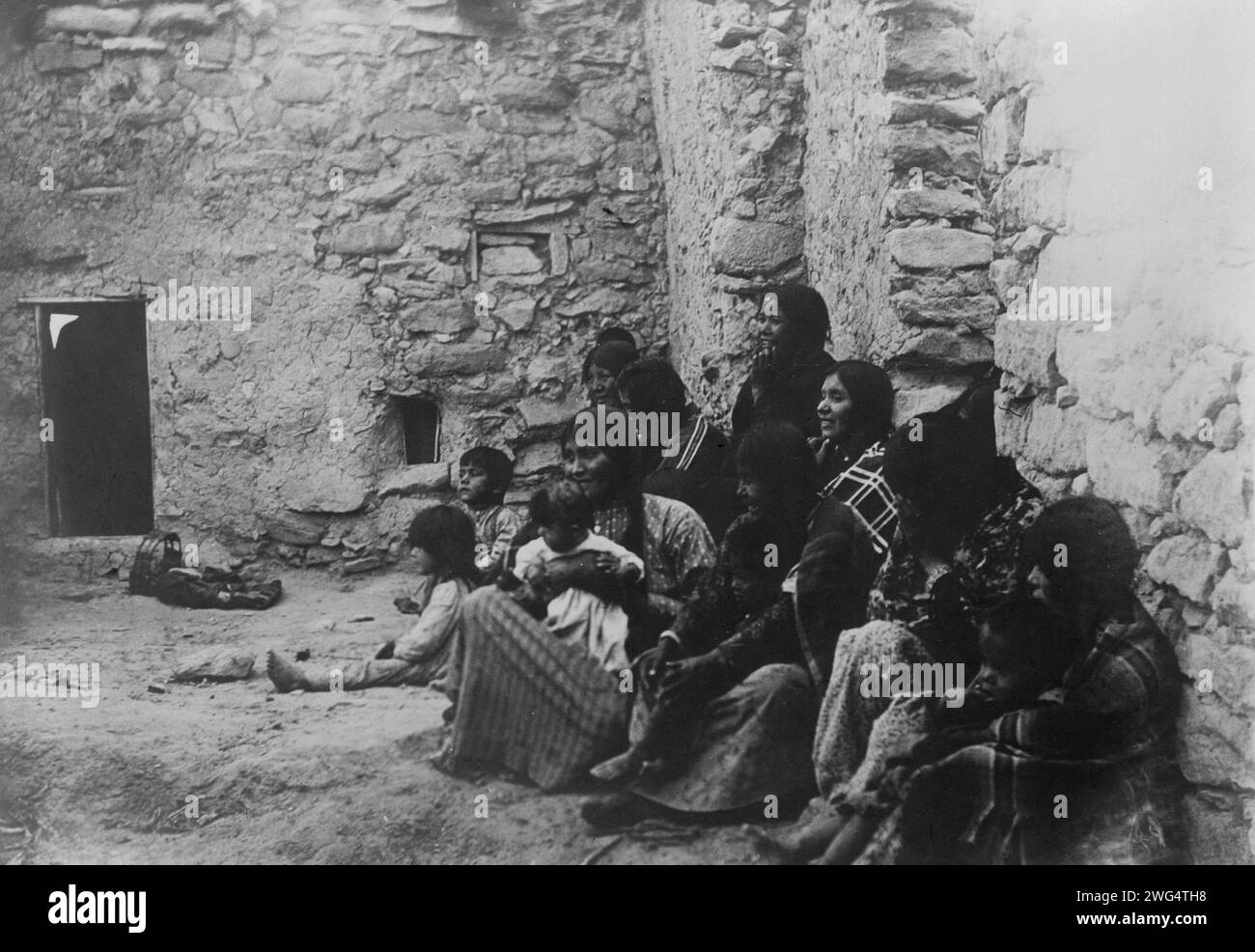 Hopi life, c1907. Several Hopi women and children seated on floor of ...