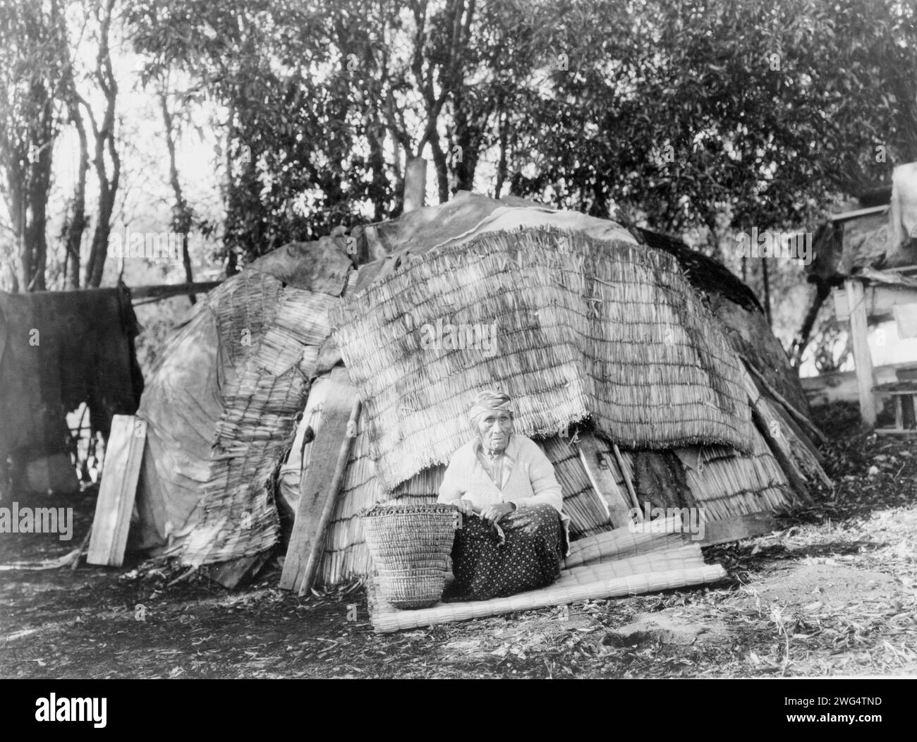 Klamath tule hut, c1923. Klamath woman, full-length portrait, facing ...