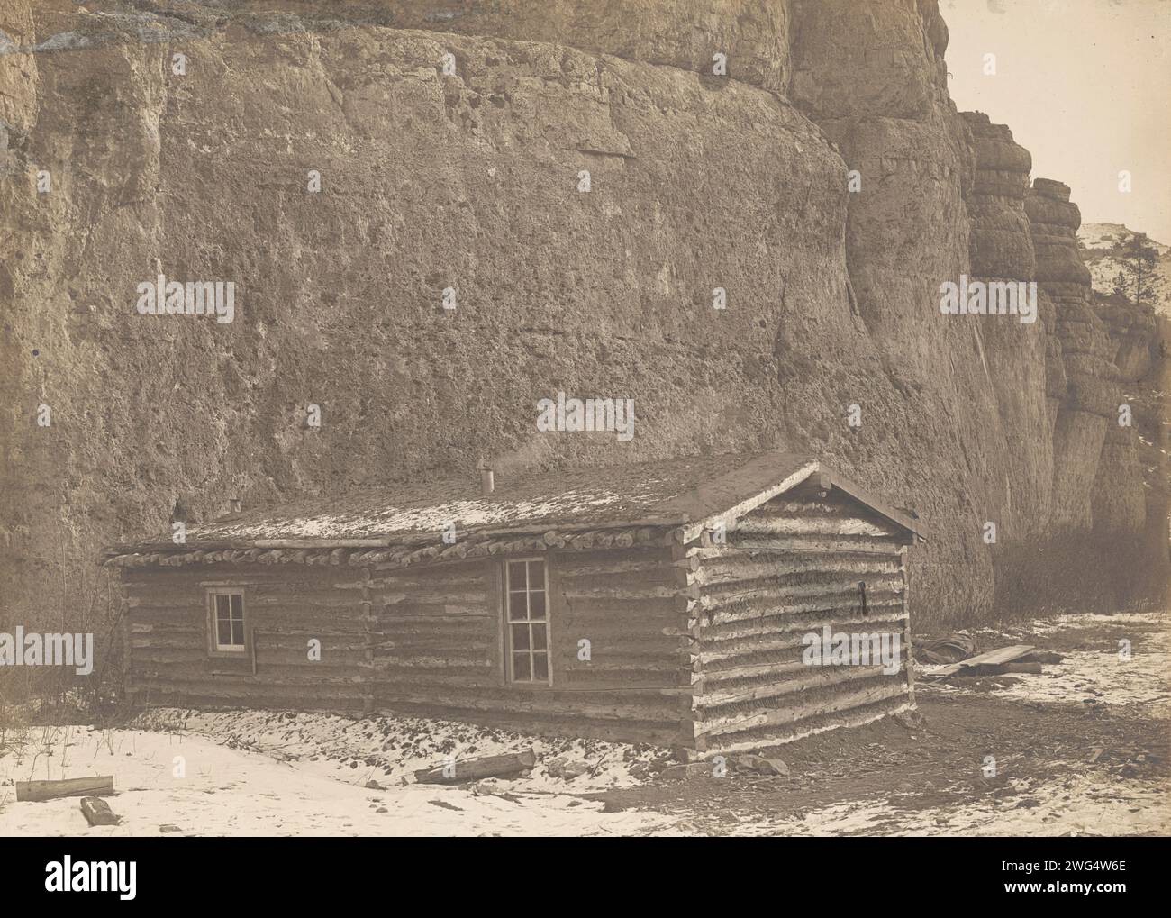 Camp Curtis, 1908. Photograph shows log cabin in clearing in front of a ...