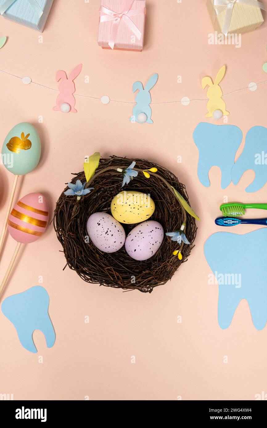Easter dentistry nest with colorful eggs and teeth top view Stock Photo ...