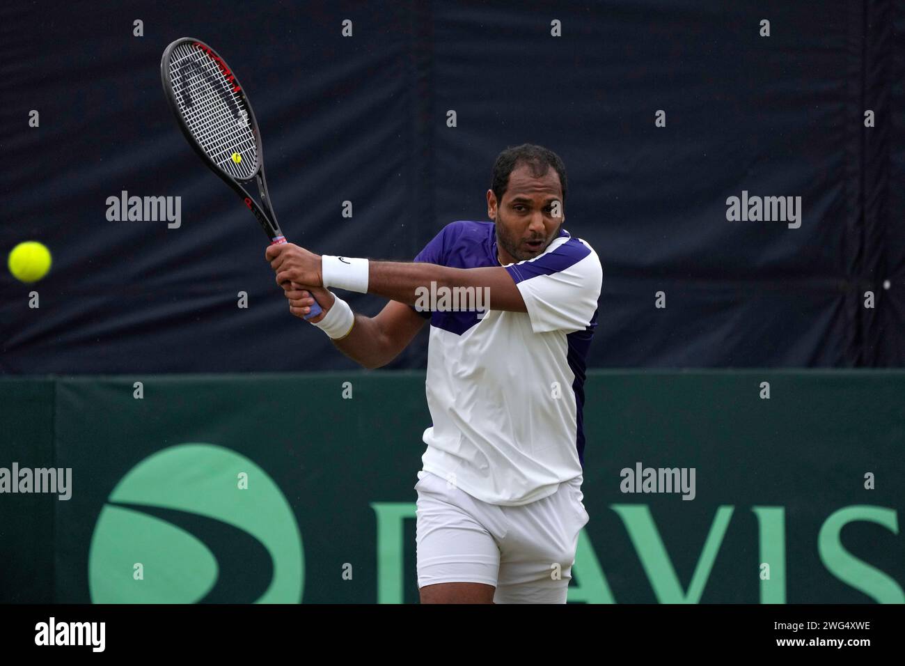India's Ramkumar Ramanathan plays a shot against Pakistan's Aisam-ul ...