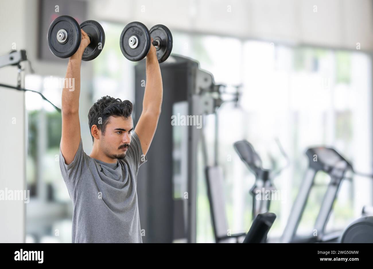 Athlete achieving peak performance, executing a flawless overhead ...