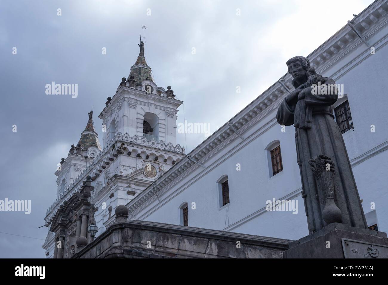 Religious sculpture in front of the oldest church in Quito Stock Photo ...