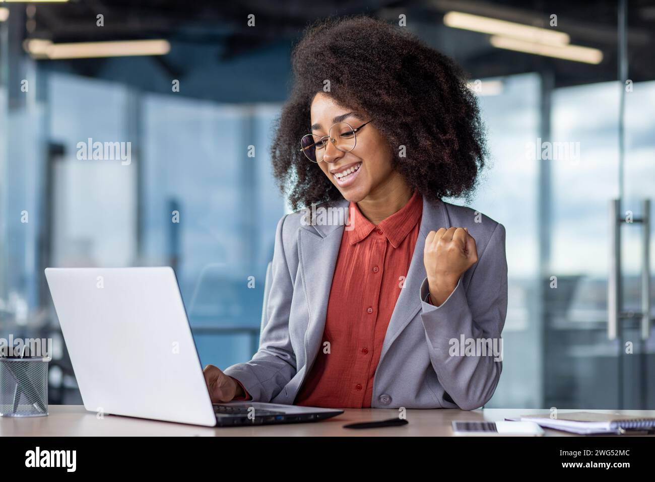 Businesswoman at workplace satisfied received successful achievement ...