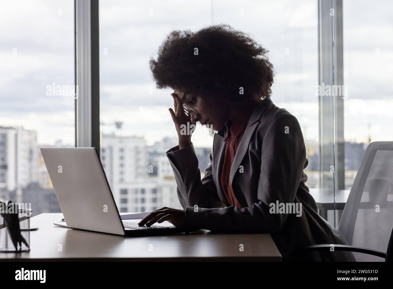 Silhouette of sad business woman at workplace inside office, female ...