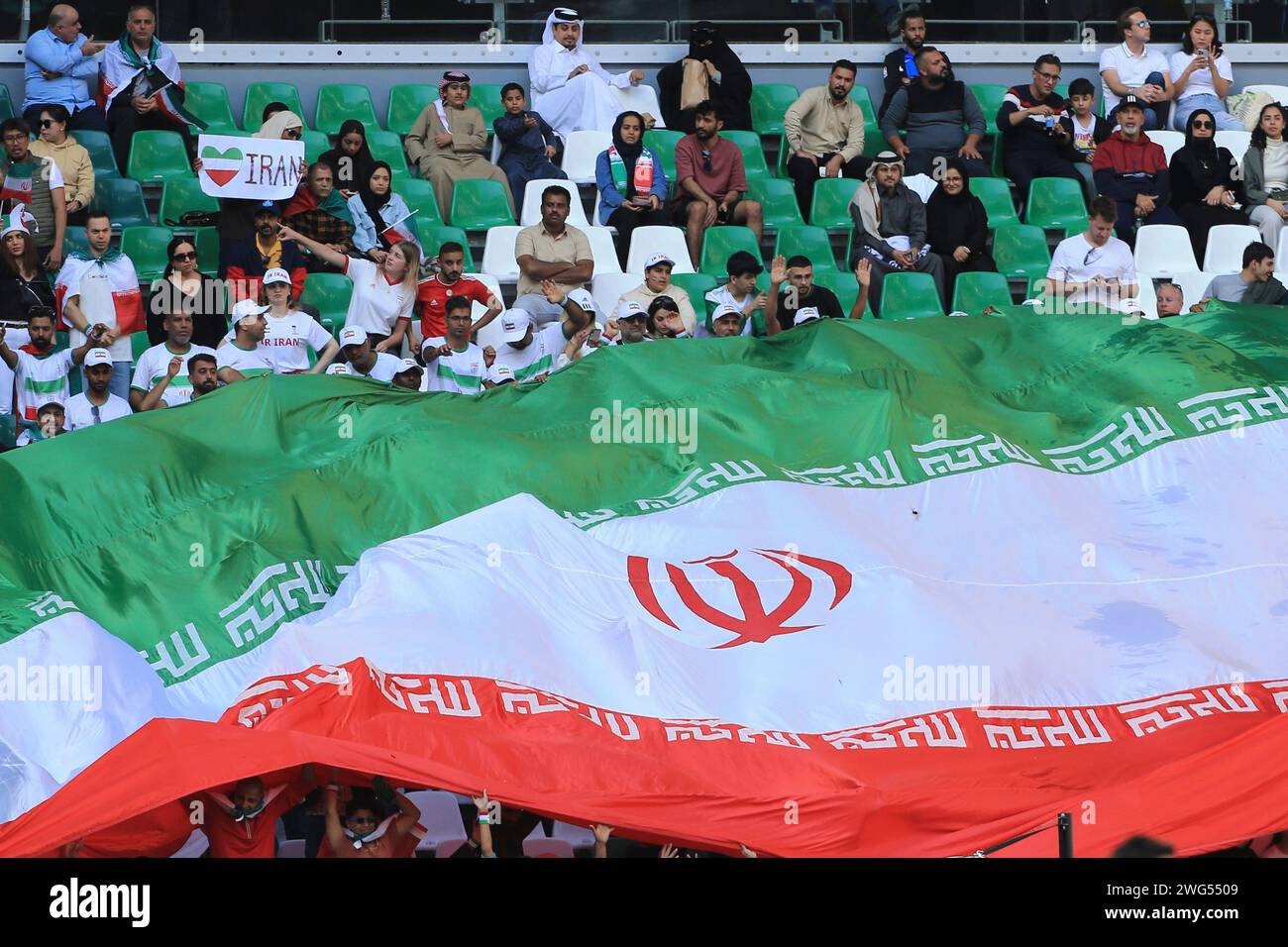 Iran's fans cheer with a huge flag during the Asian Cup quarterfinal ...
