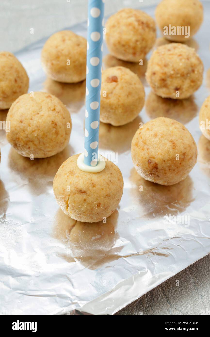 How to make cake pops - applying stick to the cake ball. Step by step ...