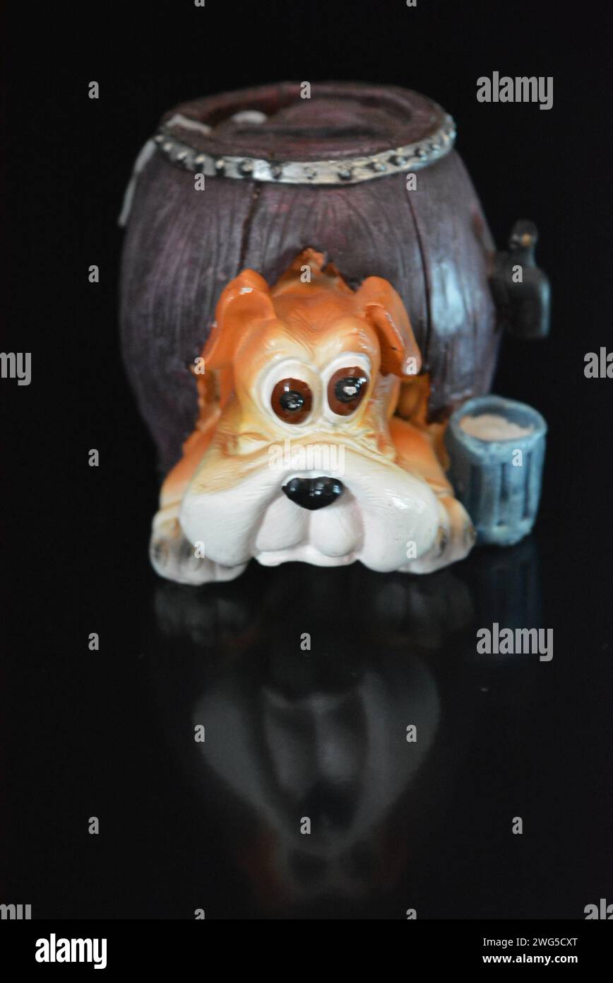 Ceramic statuette, a piggy bank for money in form of a dog looking out ...