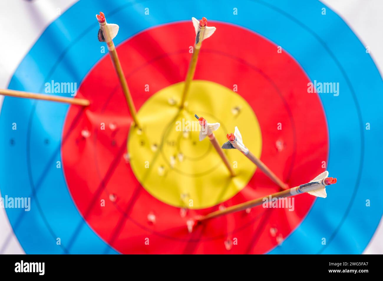 Many arrows hitting the archery target, bulls eye Stock Photo - Alamy