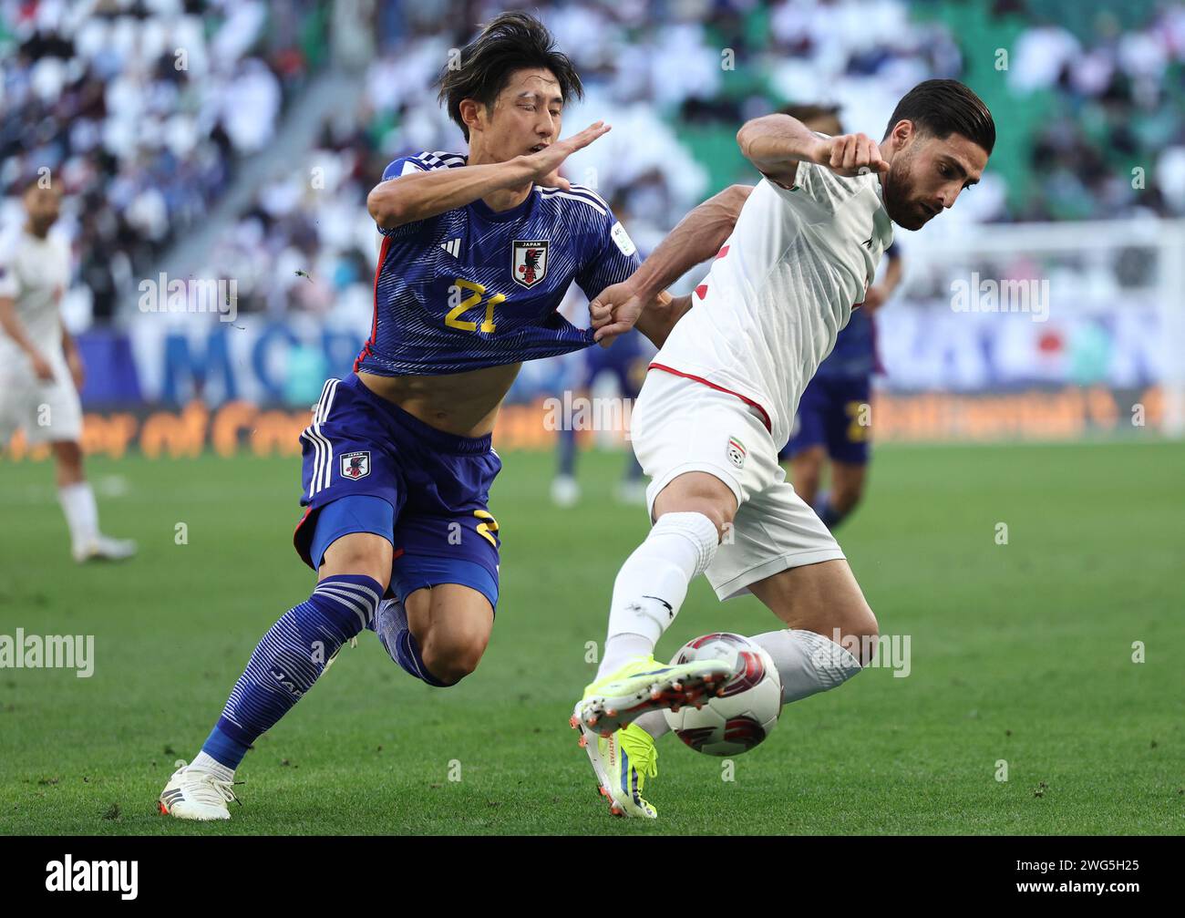 Doha, Qatar. 3rd Feb, 2024. Ito Hiroki (L) of Japan vies with Alireza ...