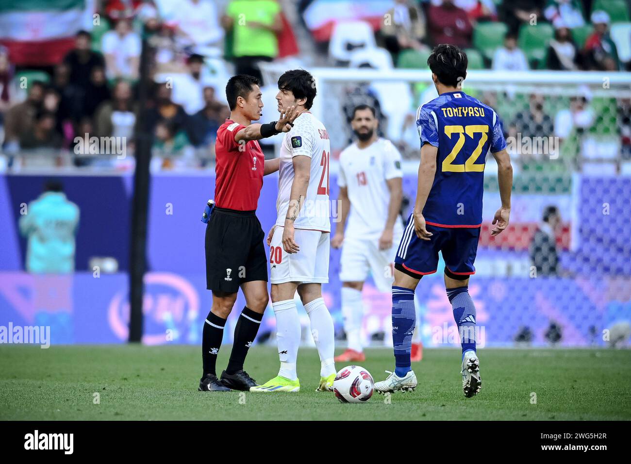 Doha, Qatar. 3rd Feb, 2024. Referee Ma Ning (L) of China talks to Iran ...