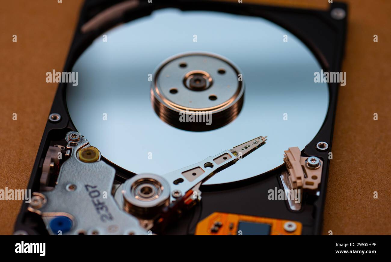 Mechanics inside a hard disk drive with platter and read write head ...