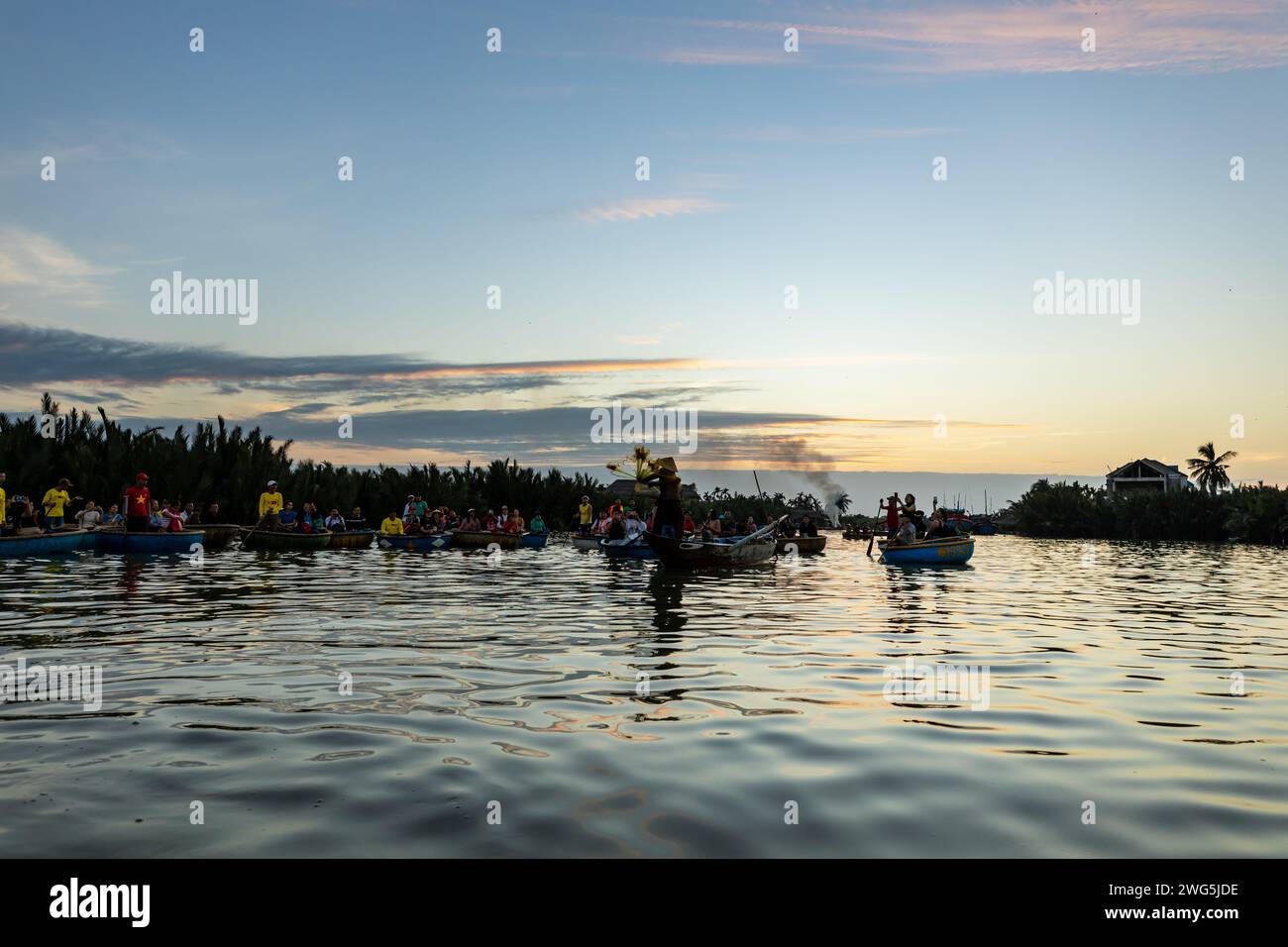 An old fisherman is throwing a net to catch fish Stock Photo - Alamy