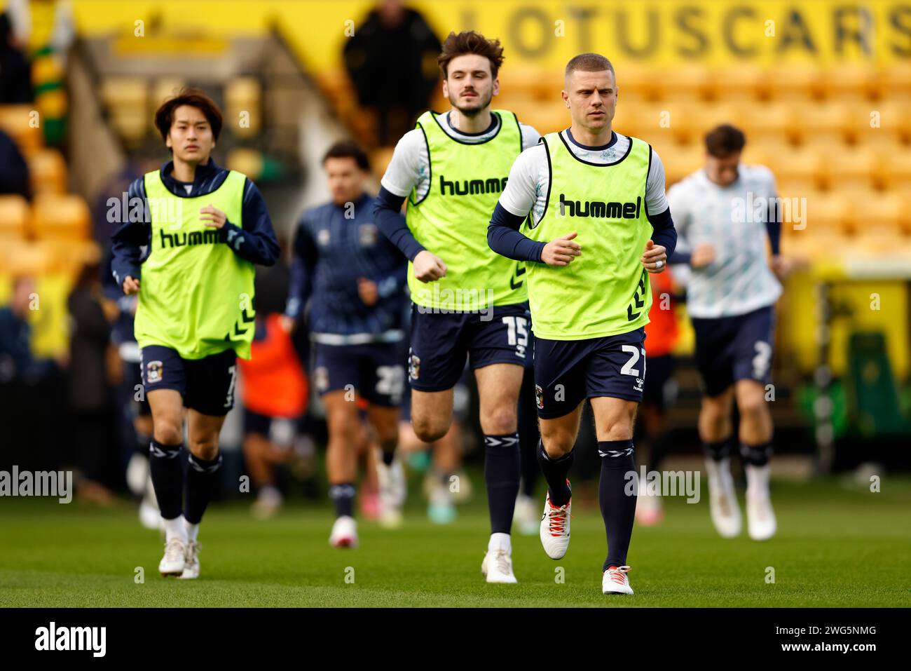 Coventry City's Jake Bidwell (right) and team-mates warming up before ...